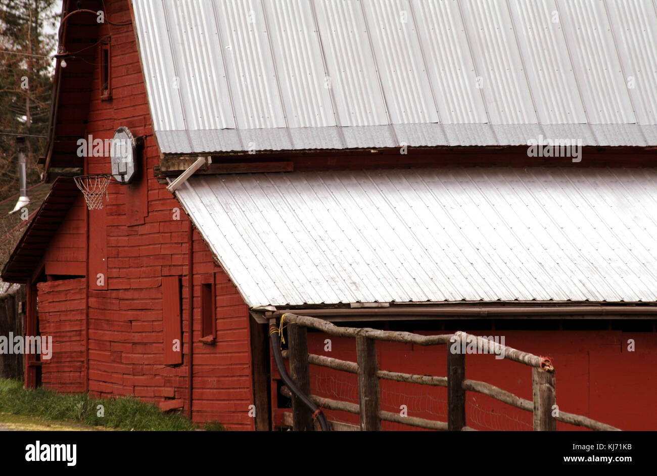 Red barn with a basketball hoop Stock Photo - Alamy