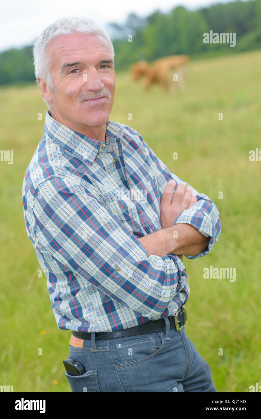 Portrait of man in field Stock Photo - Alamy