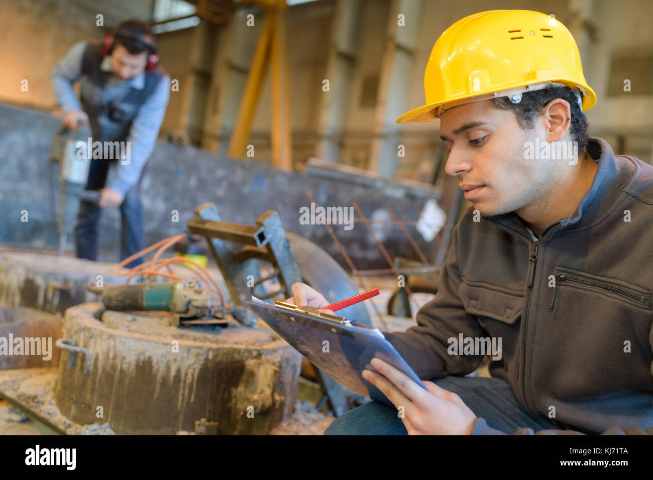 foreman doing a report Stock Photo - Alamy