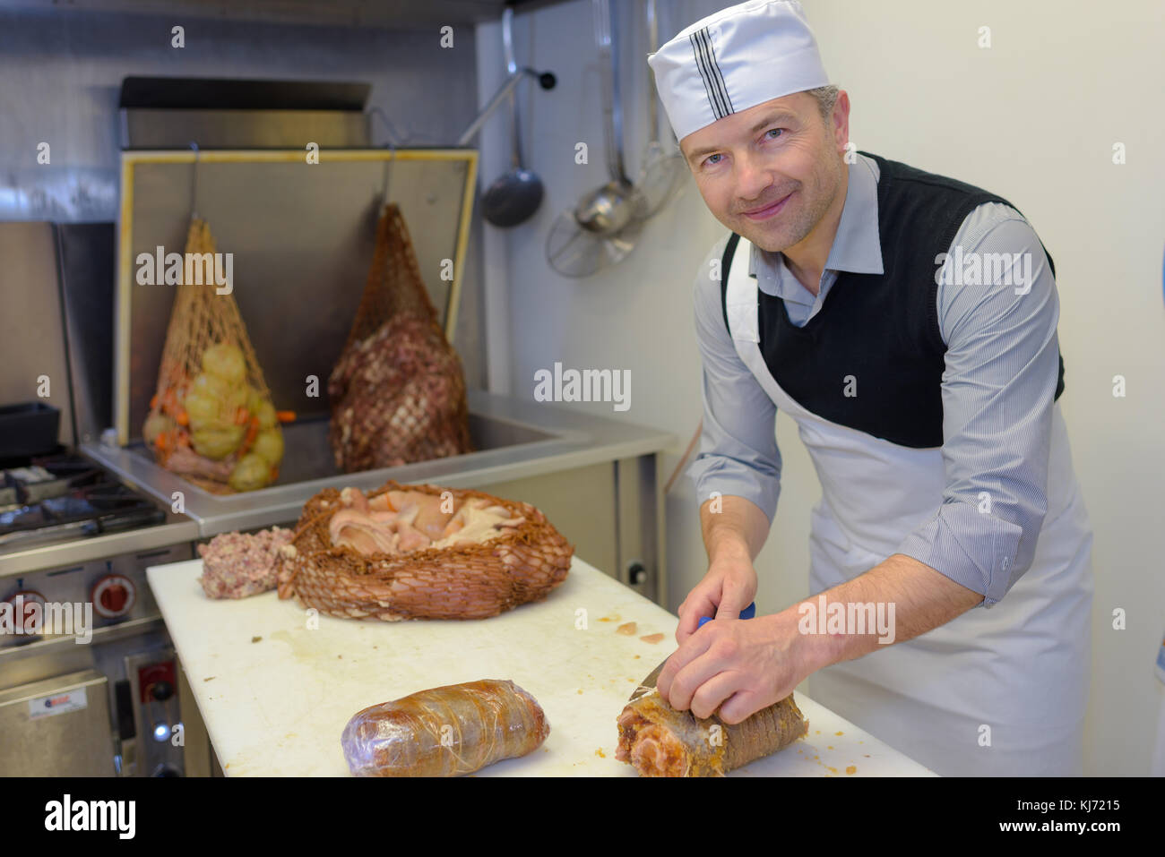 Butcher preparing food Stock Photo - Alamy