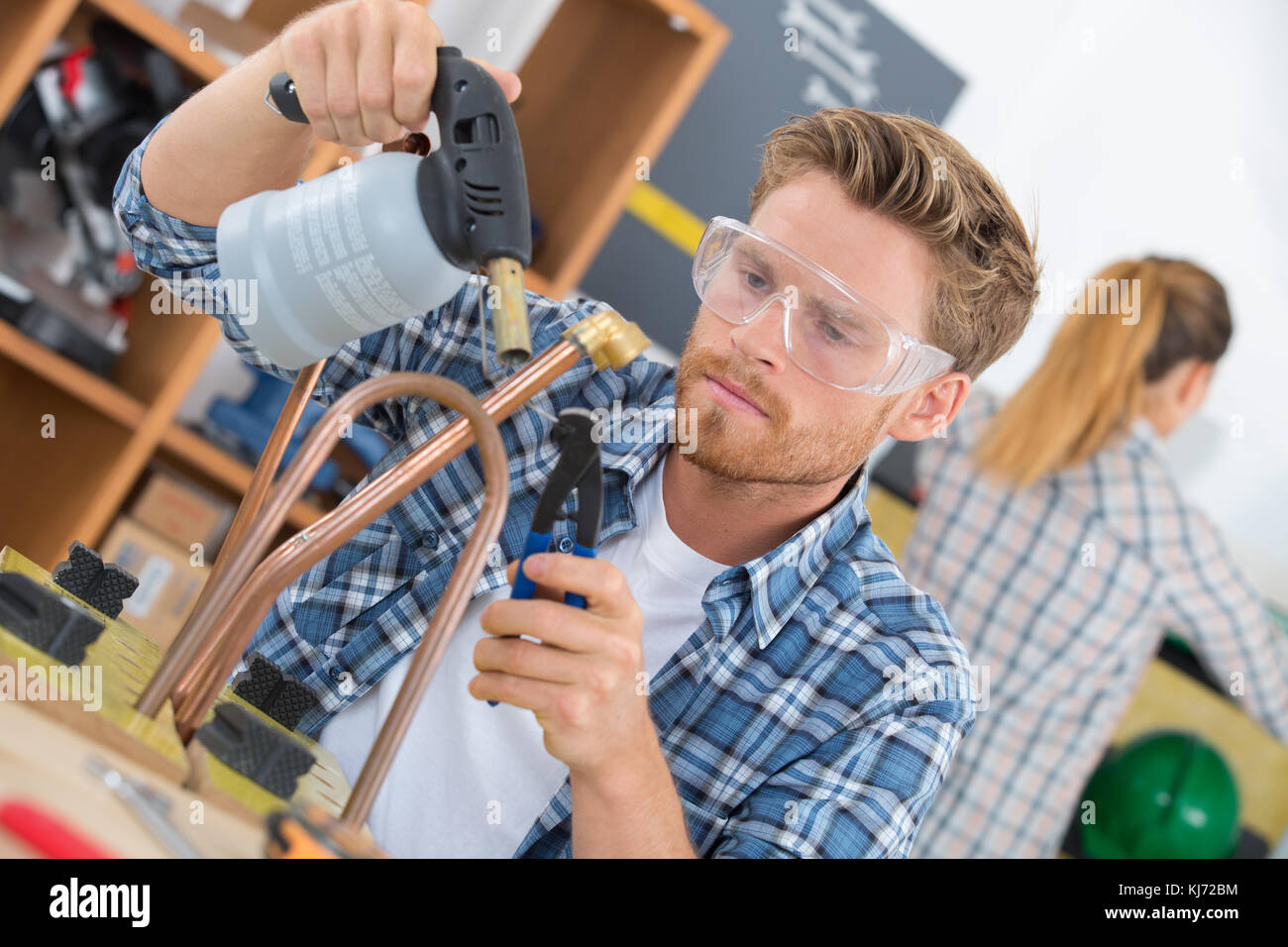 plumber welding copper pipes Stock Photo - Alamy