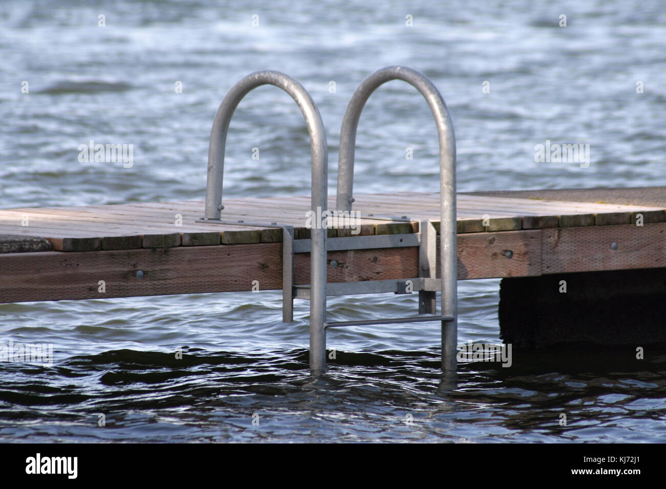 Ladder at a lake swimming down going down into the water Stock Photo ...