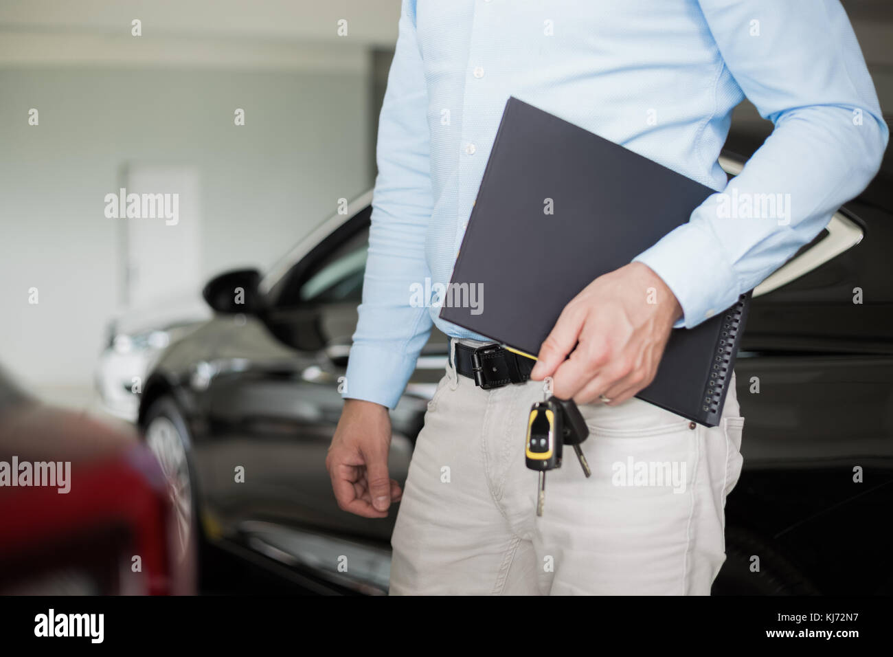Man standing behind car hi-res stock photography and images - Alamy