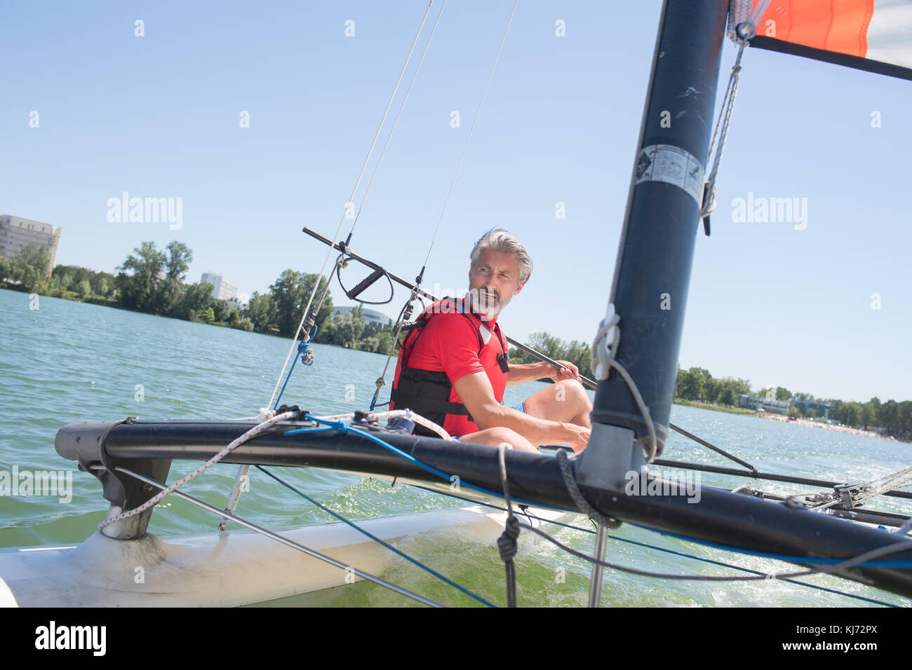enjoying extreme sailing with racing sailboat Stock Photo - Alamy