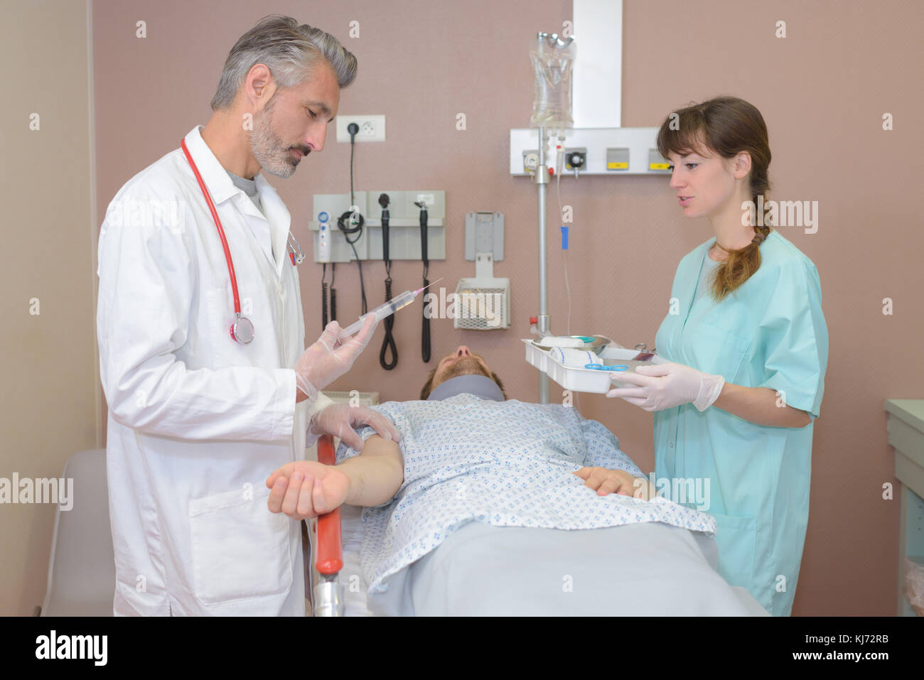 Doctor preparing patient for an injection Stock Photo - Alamy