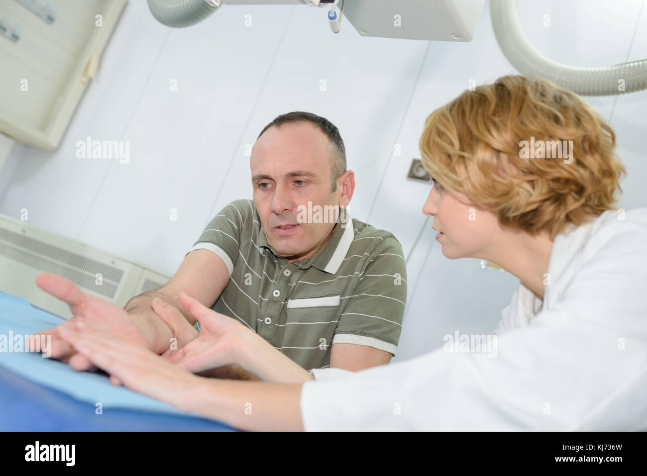 examining the patients hands Stock Photo - Alamy