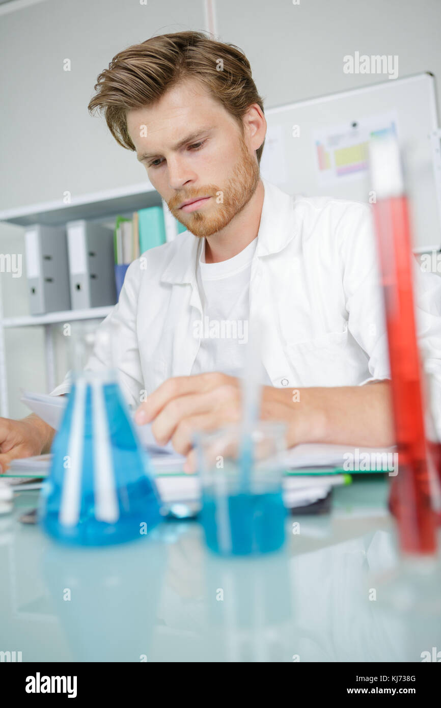 man in the laboratory with flasks Stock Photo - Alamy