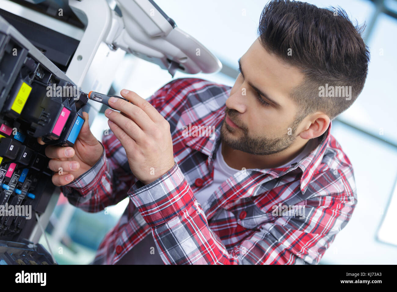 technician fixing photocopier machine Stock Photo - Alamy