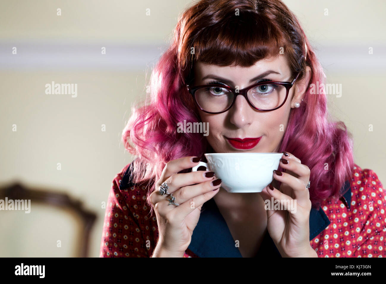 Vintage themed tea girl on a old retro house Stock Photo - Alamy