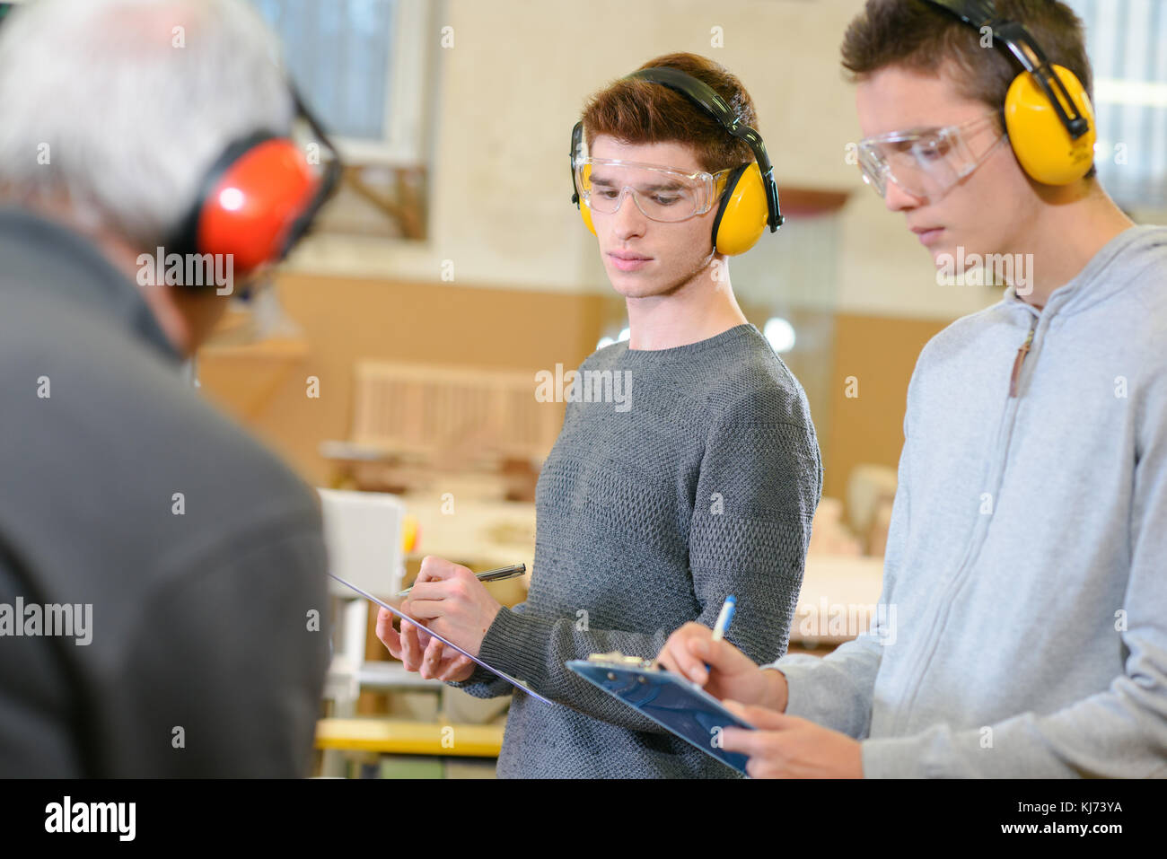student and teacher in carpentry class Stock Photo - Alamy