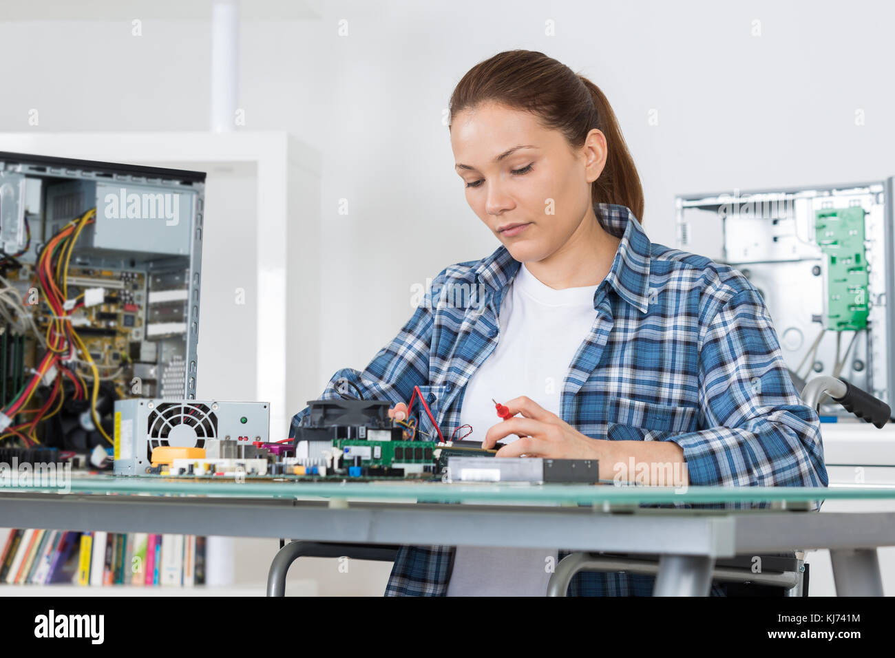 female technician working with transistor Stock Photo - Alamy