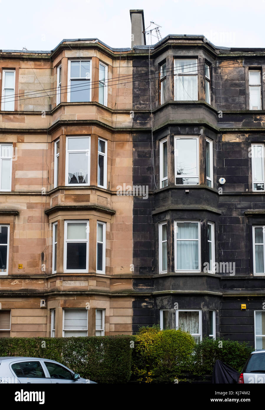 View of typical sandstone tenement apartment buildings , one after ...