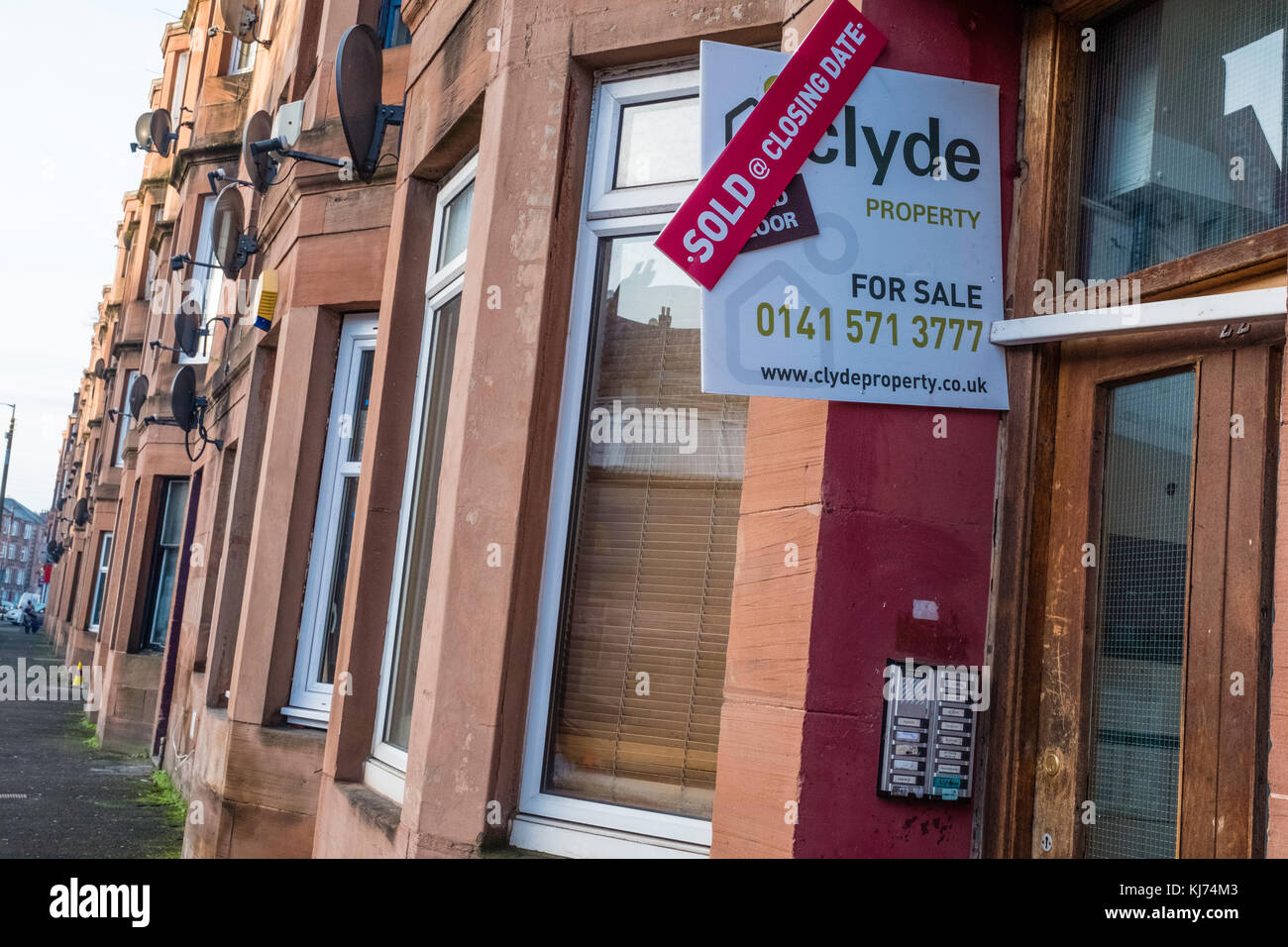Sold sign outside tenement apartment building in Govanhill district of ...