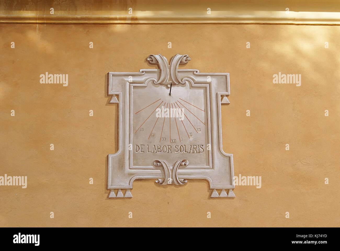 Sundial with latin text "De labor Solaris" in the french village of ...