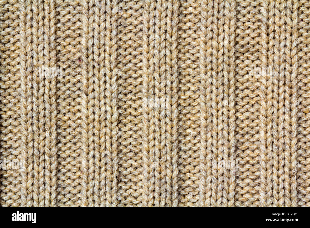 Background texture of beige pattern knitted fabric made of cotton or ...
