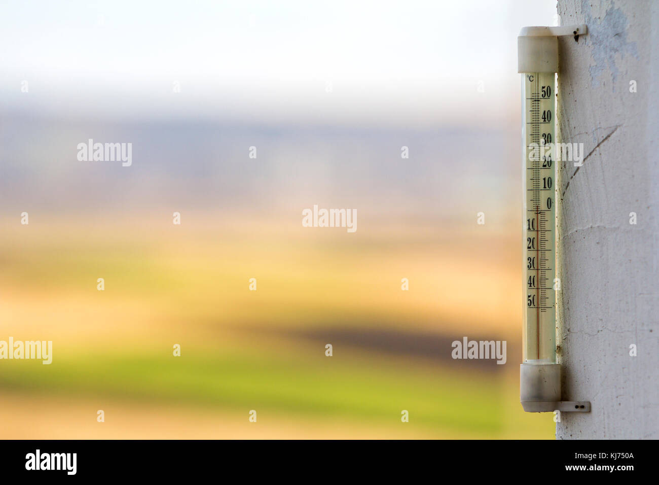 Thermometer celsius showing cold temperature on blurred background ...