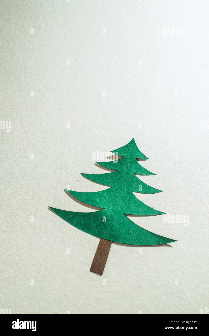 Christmas pine tree made of paper on paper background. Origami ...