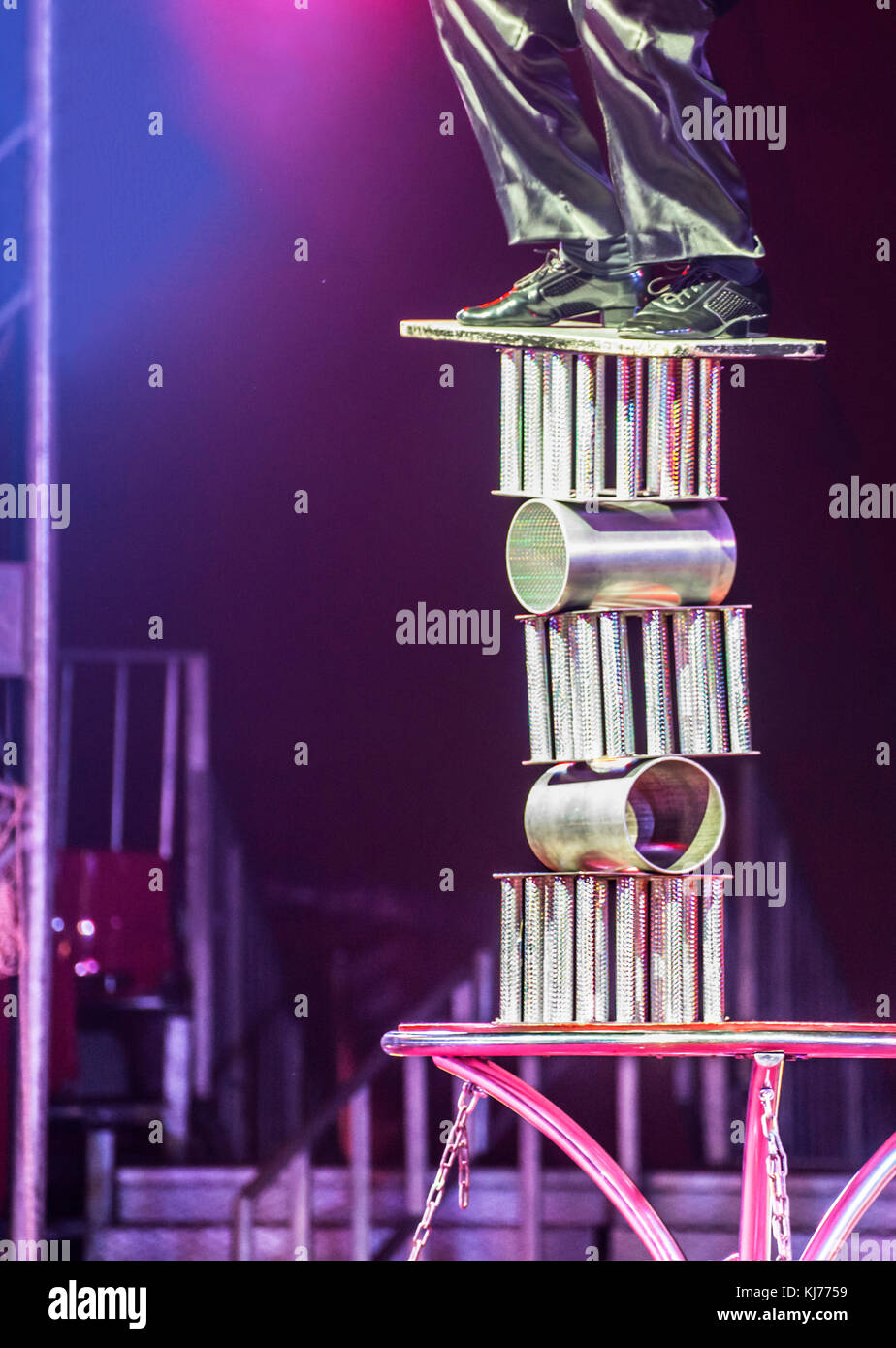 Circus equilibrist artist balancing on rings. Circus arena Stock Photo ...