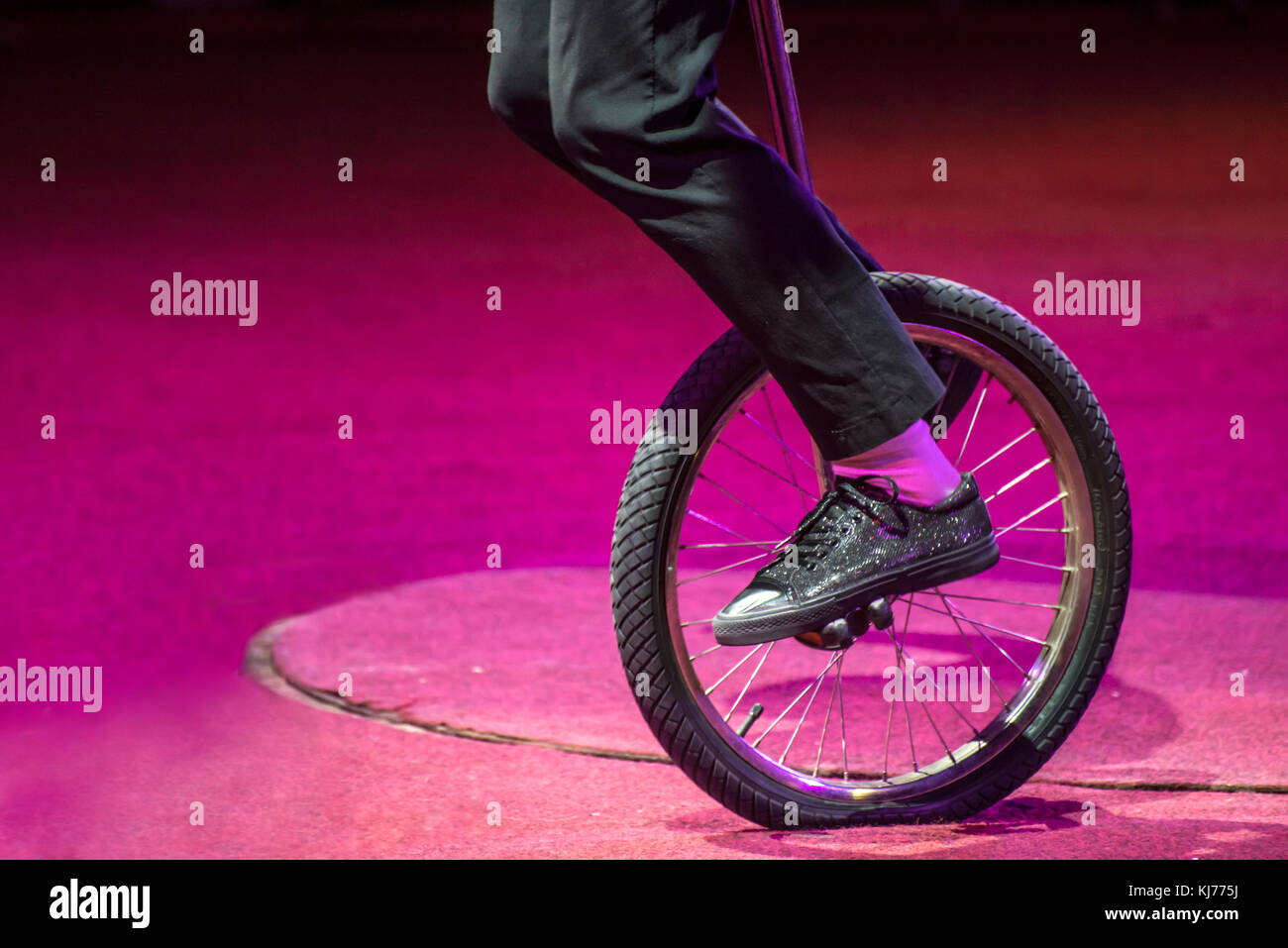 Circus artist bike in circus Stock Photo - Alamy