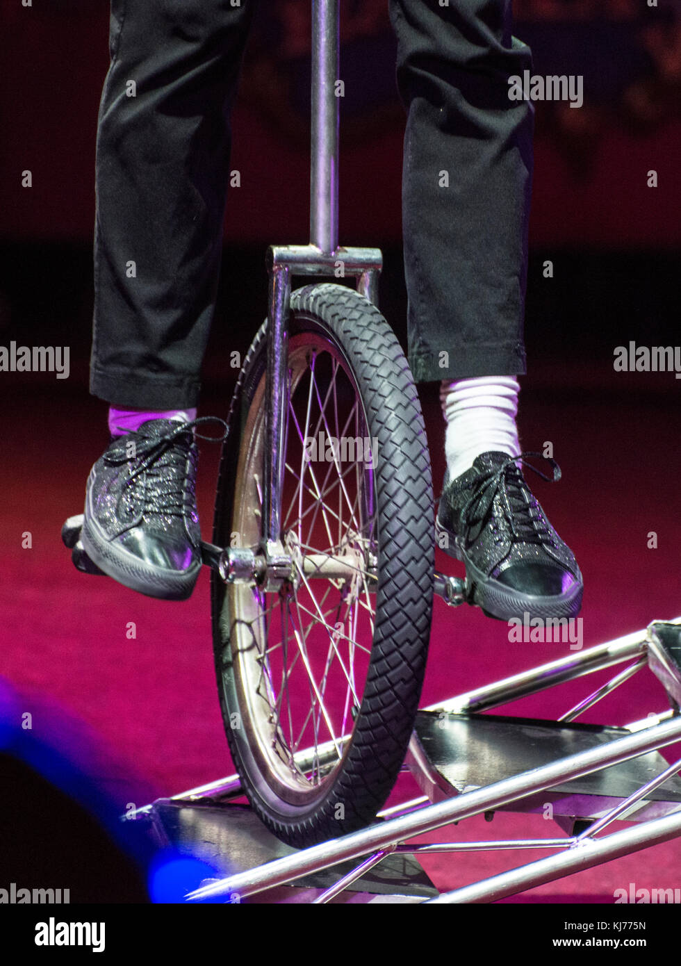 Circus artist bike in circus Stock Photo - Alamy