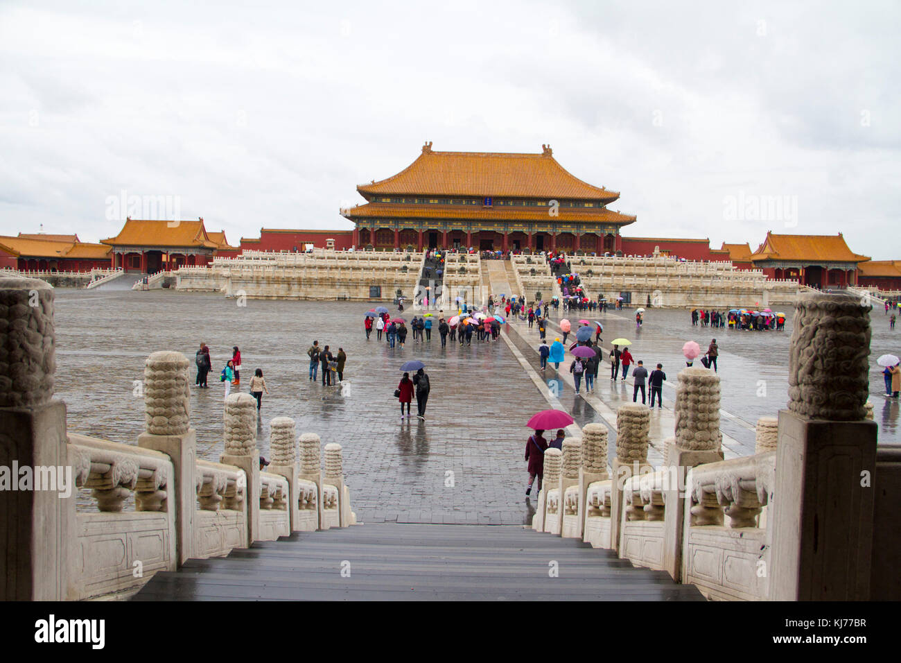 Tourists walk through the palace complex of the Forbidden City in ...
