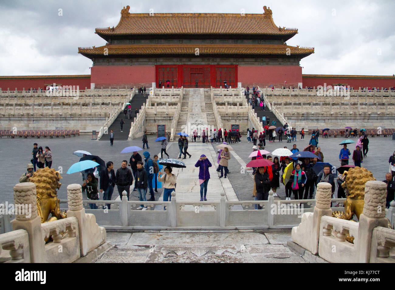 Tourists walk through the palace complex of the Forbidden City in ...