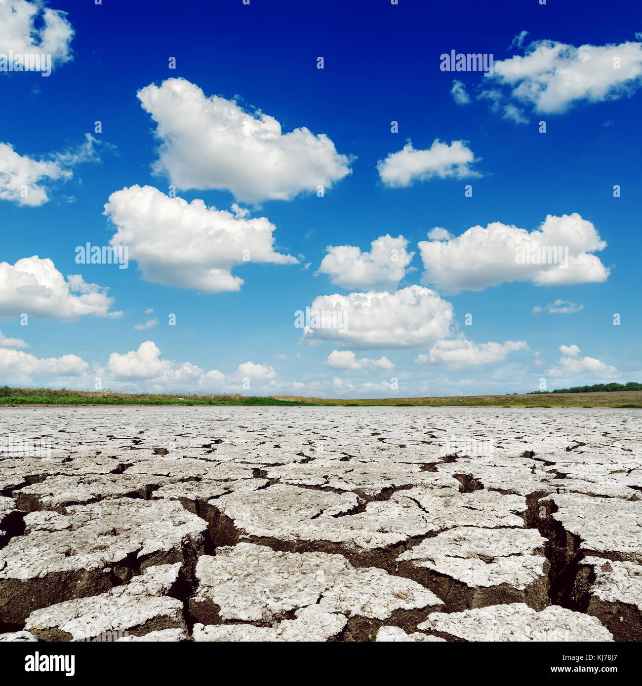 deep blue sky with clouds over drought earth Stock Photo - Alamy