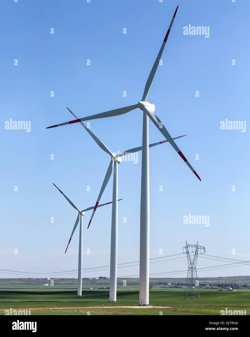 Green renewable energy concept - wind generator turbines in sky Stock ...