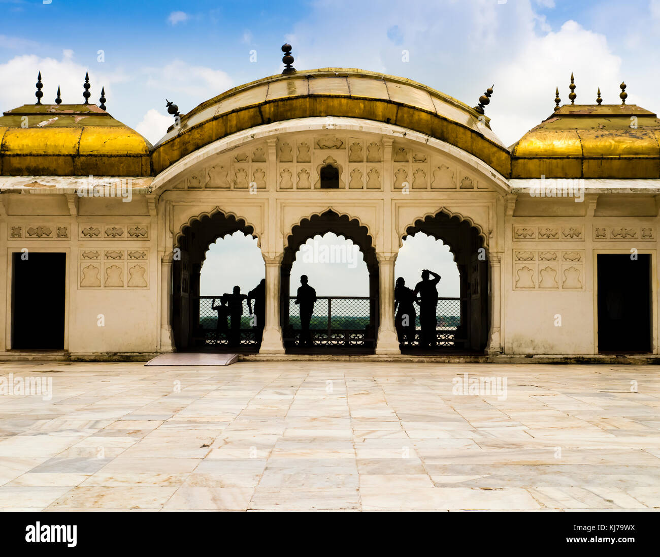 Indian family admires Taj Mahal from the golden pavilions of Agra Fort ...