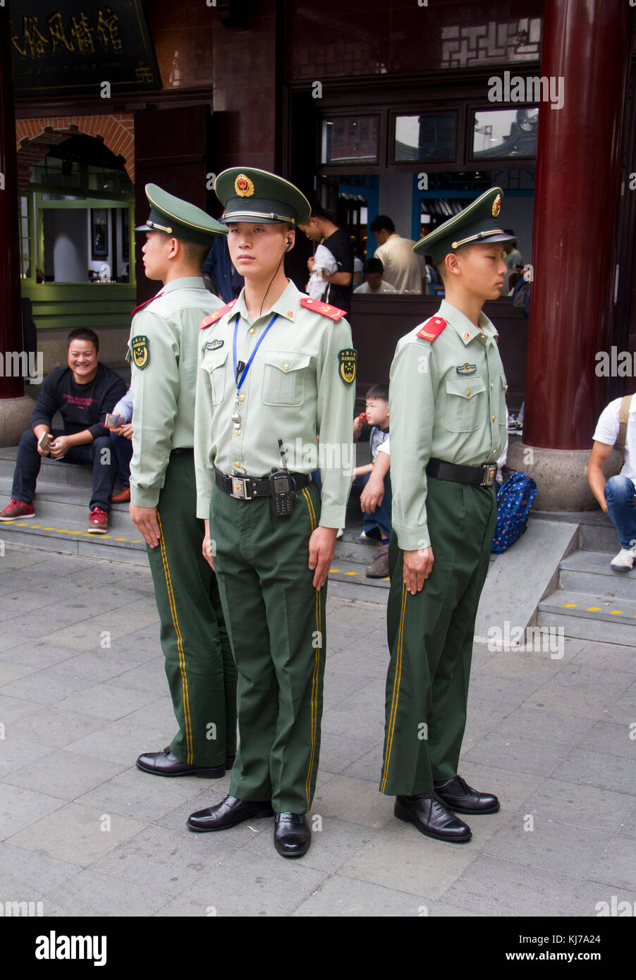 Chinese soldiers stand in the street in the Yuyuan Gardens section of ...