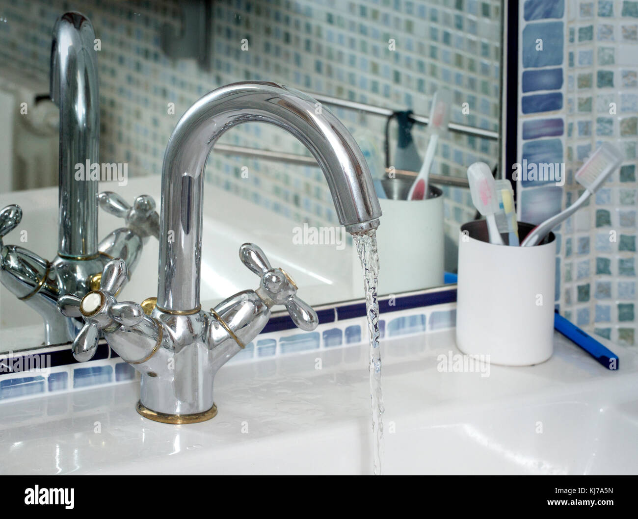Water drop from faucet Stock Photo - Alamy