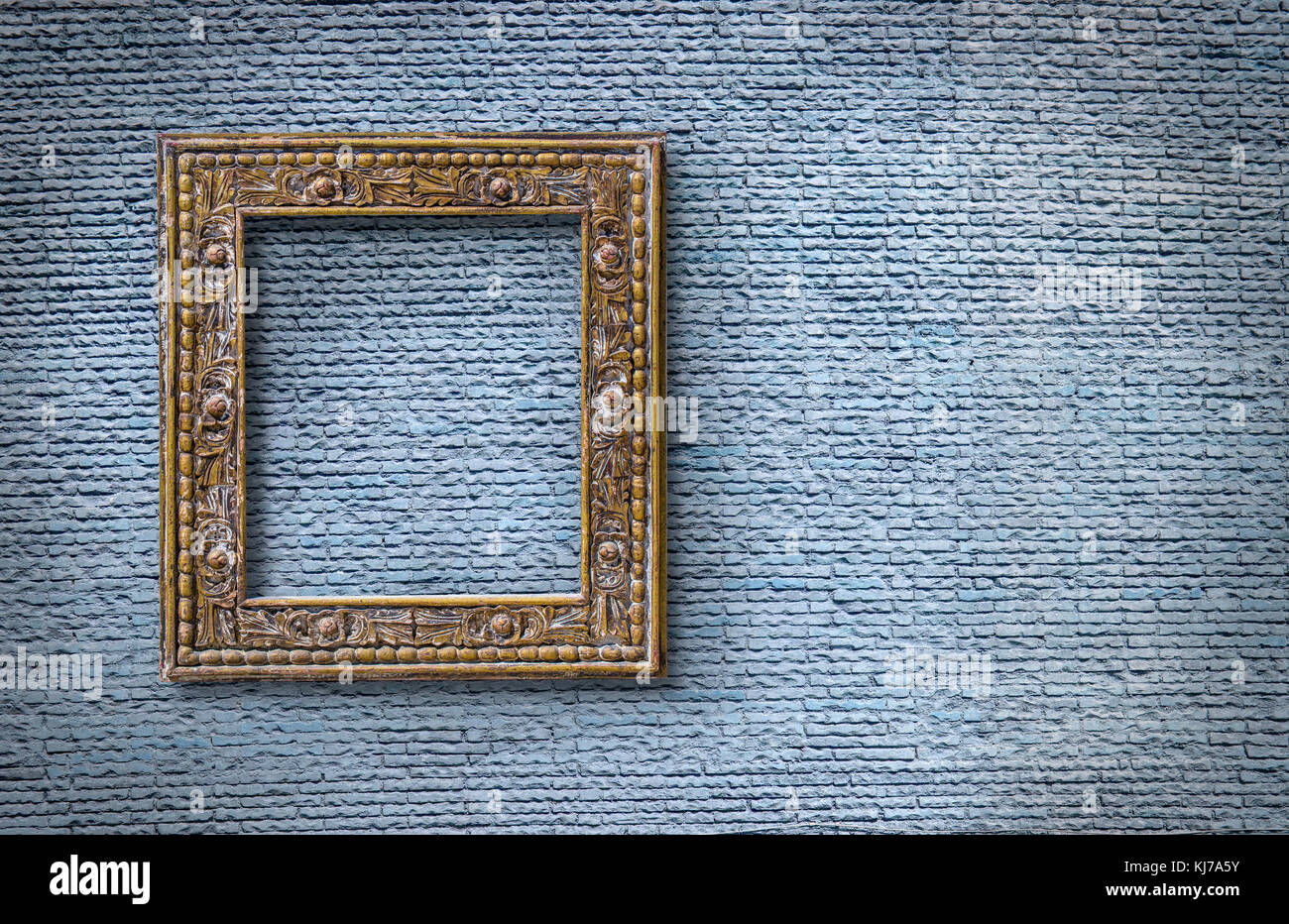 Picture frame on light blue brick wall Stock Photo - Alamy
