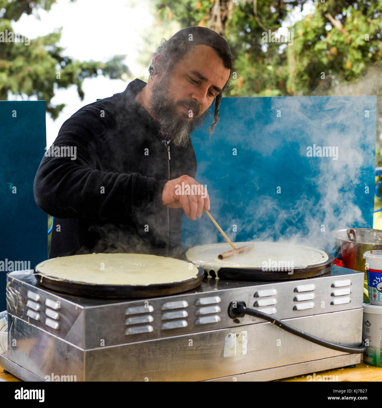 Jewish man preparing crepe, Safed, Northern District, Israel Stock ...
