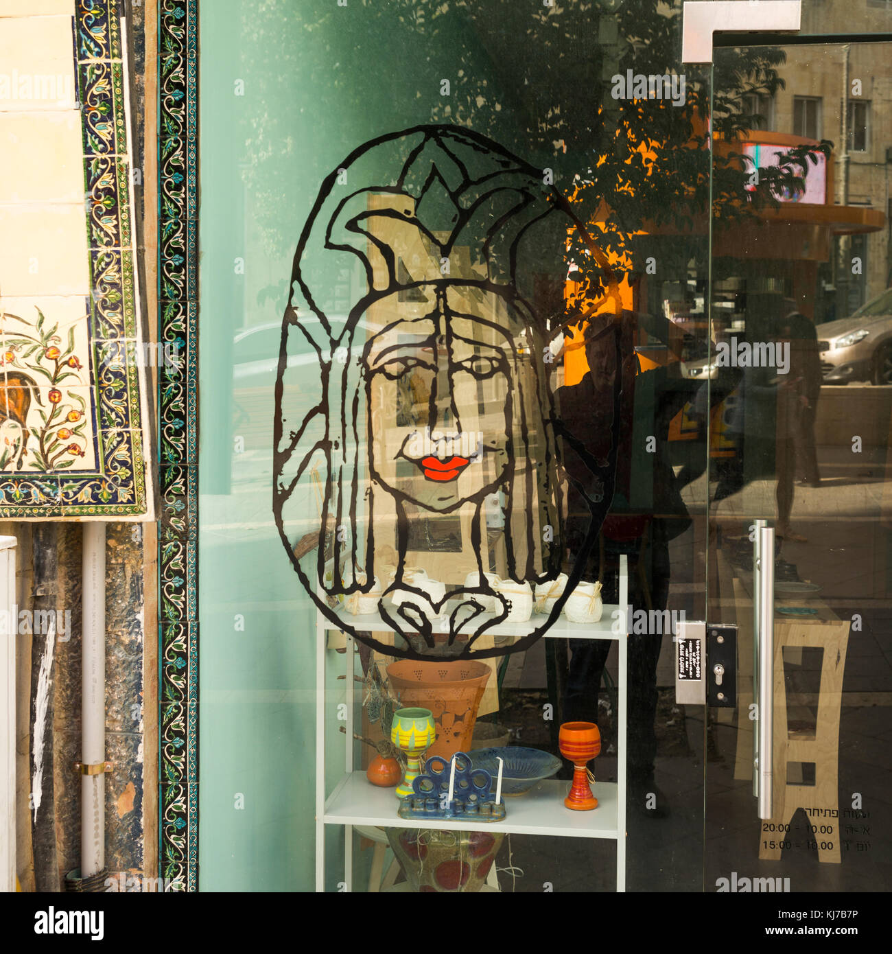 Close-up of picture on the glass entrance door of store, Jerusalem ...