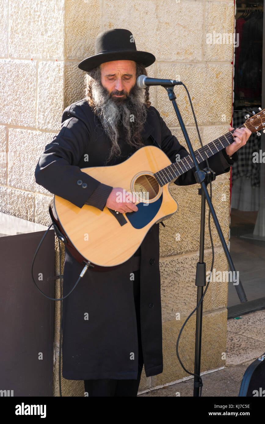 Jewish man playing guitar, Jerusalem, Israel Stock Photo - Alamy
