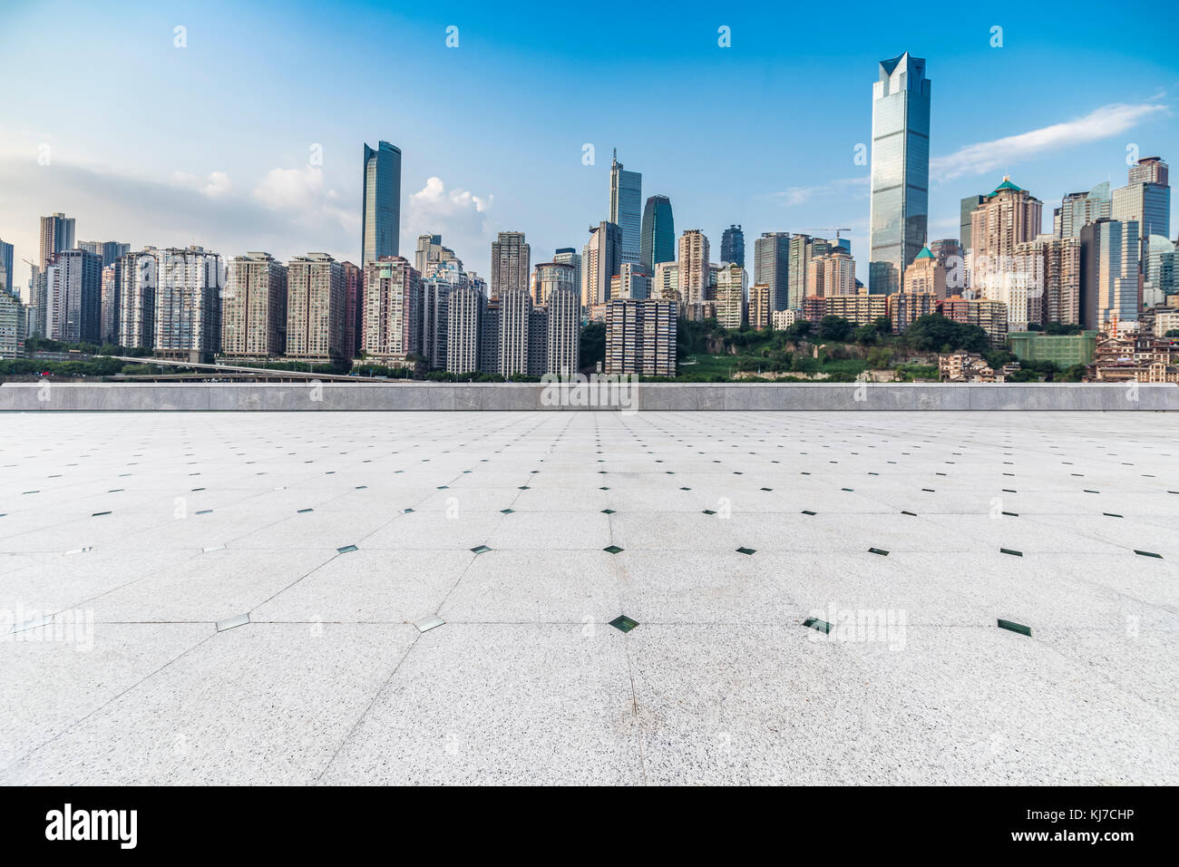Panoramic skyline and buildings with empty concrete square floor ...
