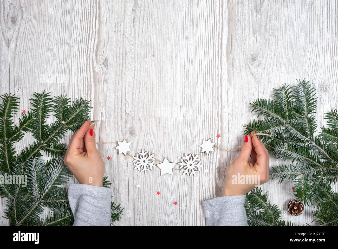 Gifts in hands with Christmas background Stock Photo - Alamy