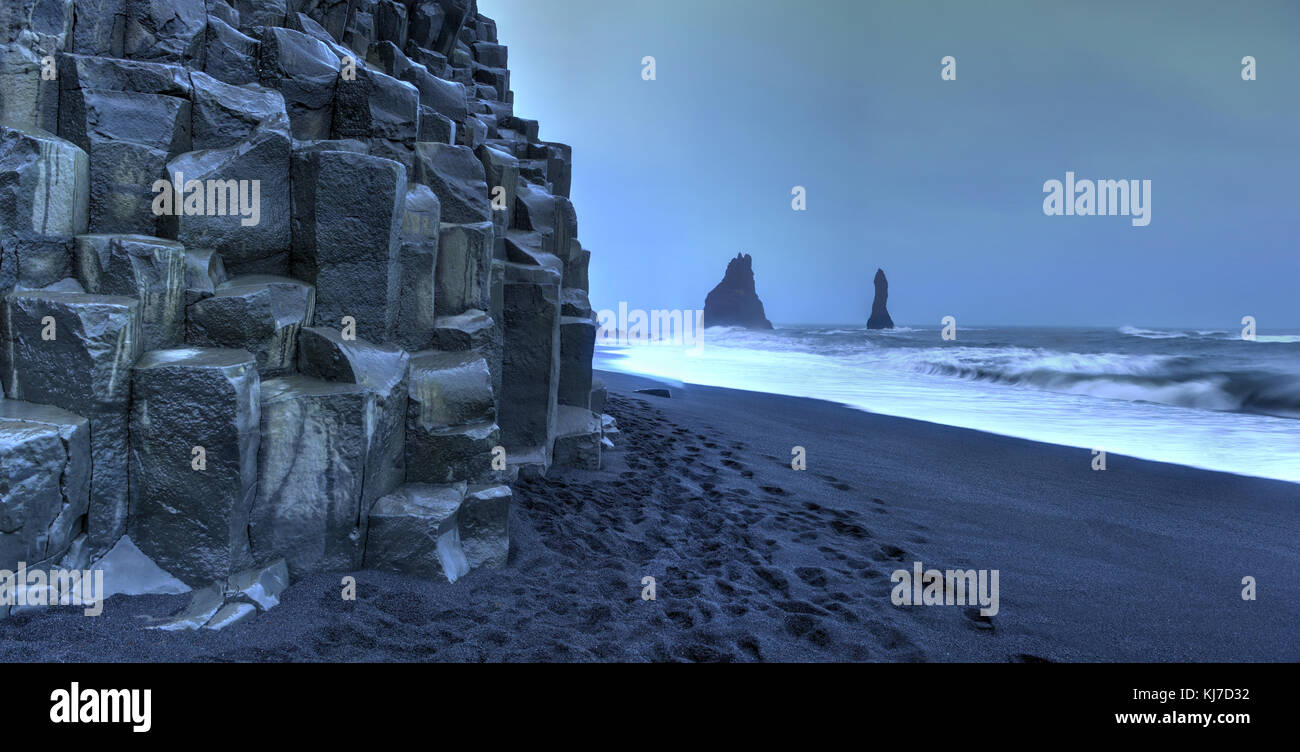 Panoramic view of Reynisdrangar rock formations on Reynisfjara Beach at ...