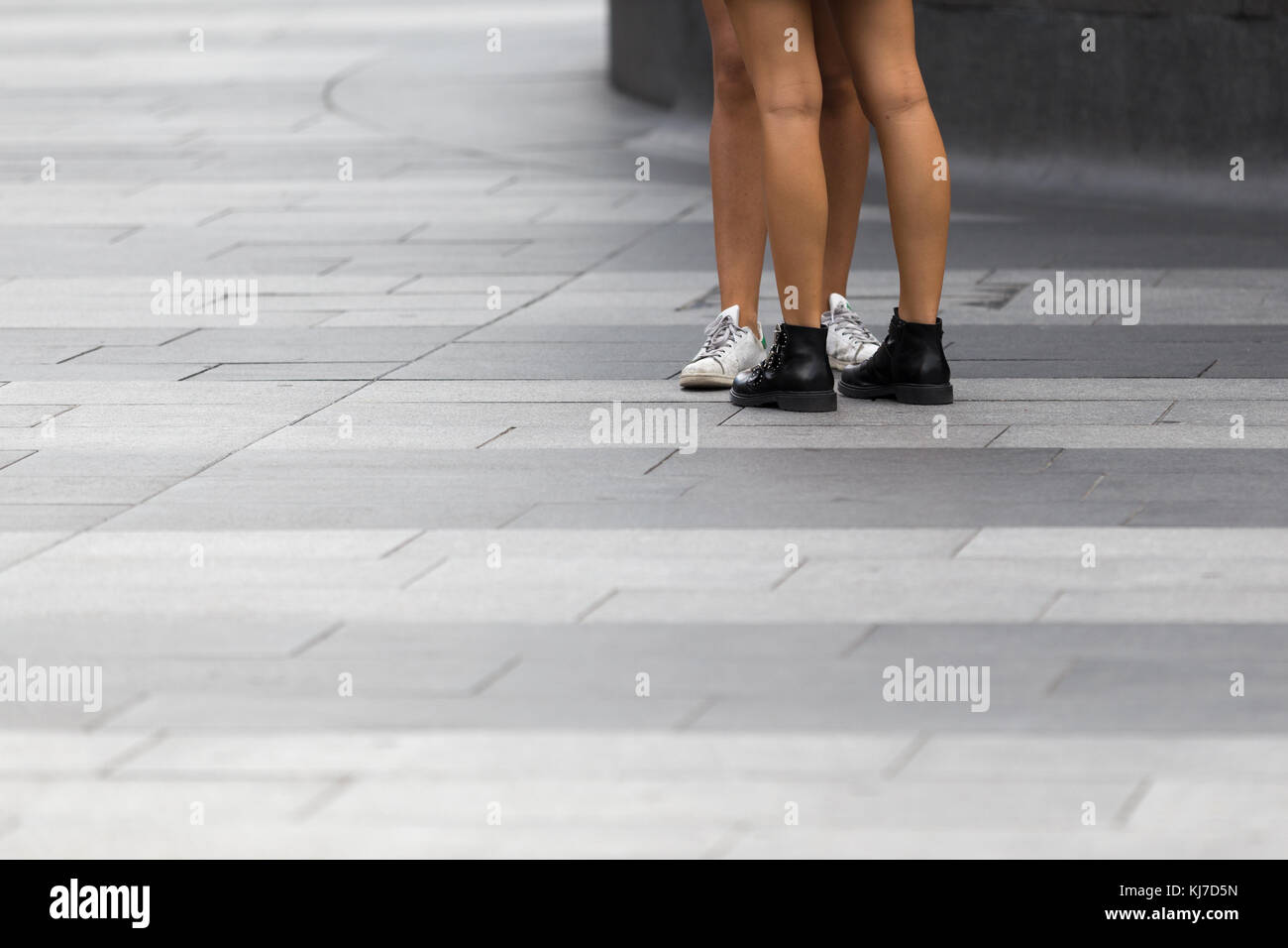 Crossed Legs at Kings Cross Square Stock Photo - Alamy