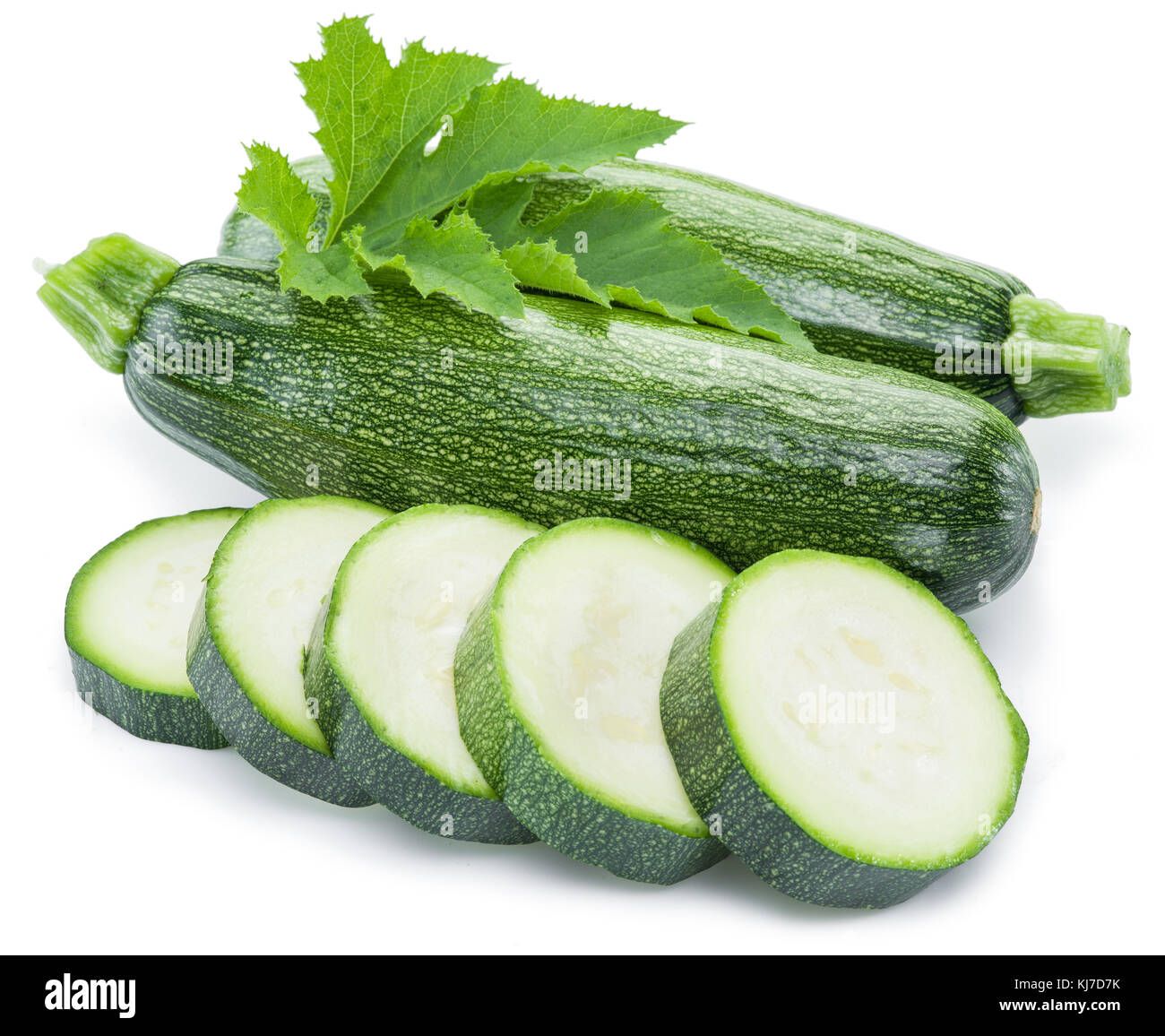 Zucchini with slices on a white background Stock Photo - Alamy