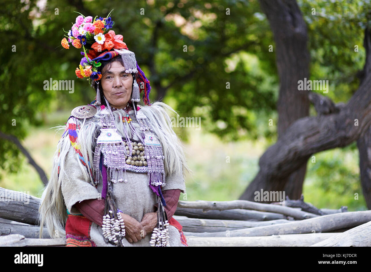 Aryan woman dressed in traditional clothes and flower decoration on her ...