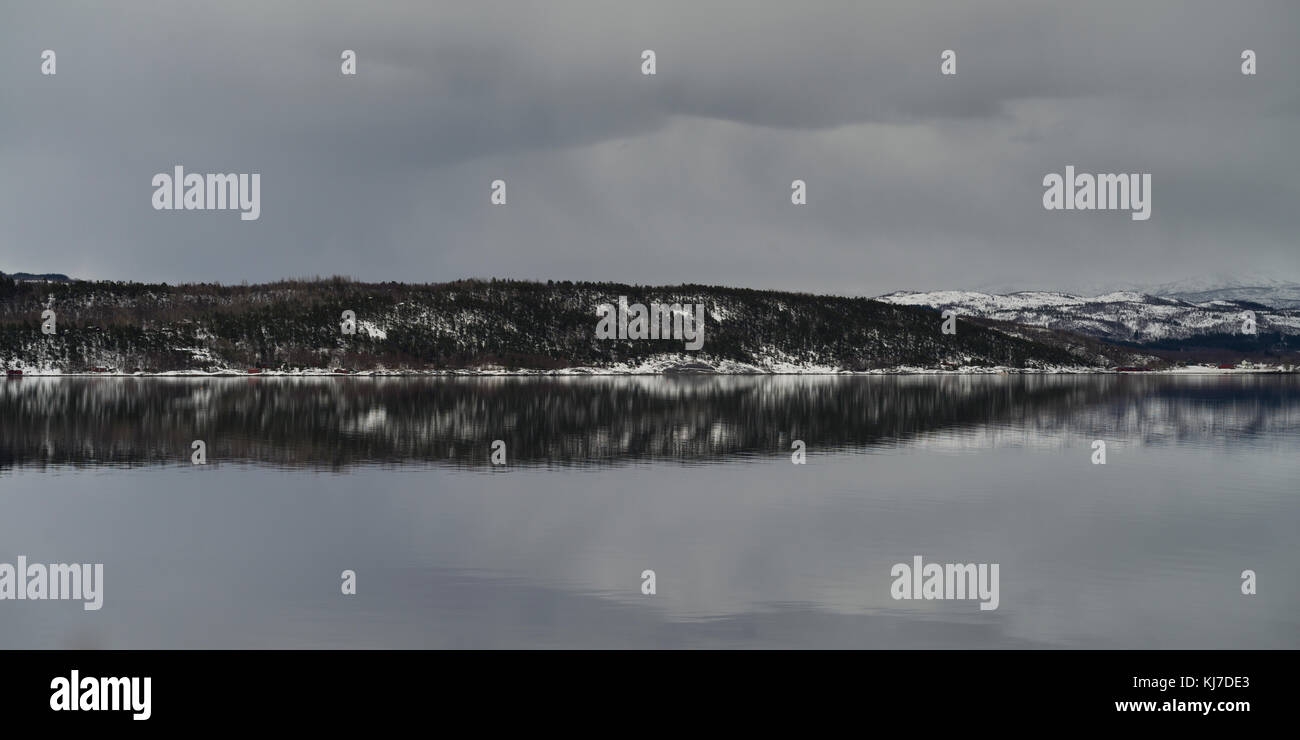 Reflection of mountain in water, Saltdal Fjord, Norway Stock Photo - Alamy