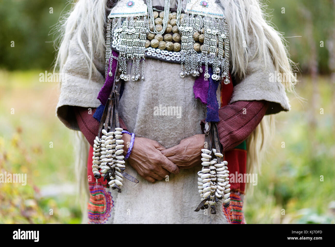 Hands of Aryan woman in traditional dress, Dah Hanu, Ladakh; Jammu and ...