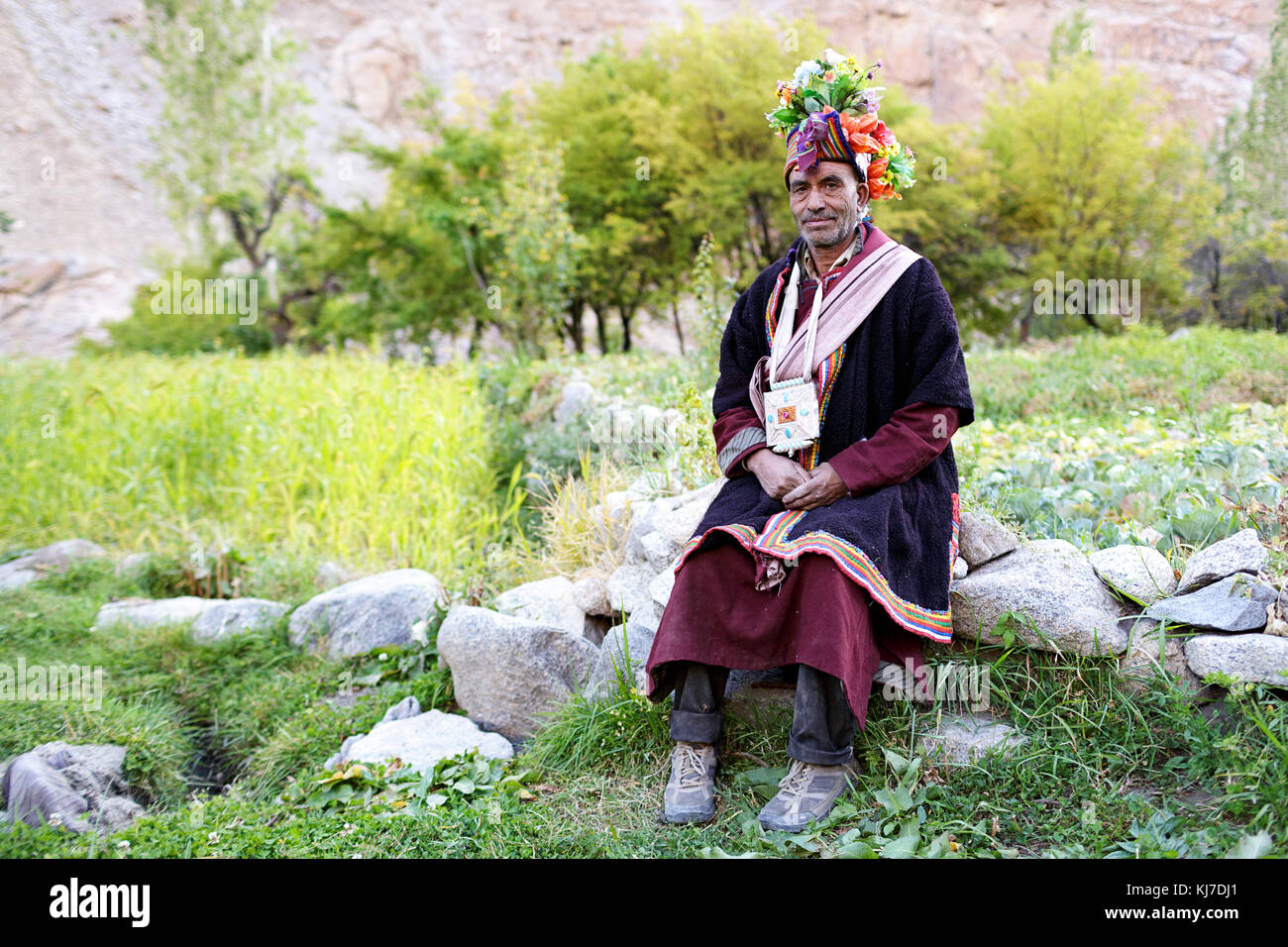 Elder Aryan man in traditional dress standing in the field, Dah Hanu ...