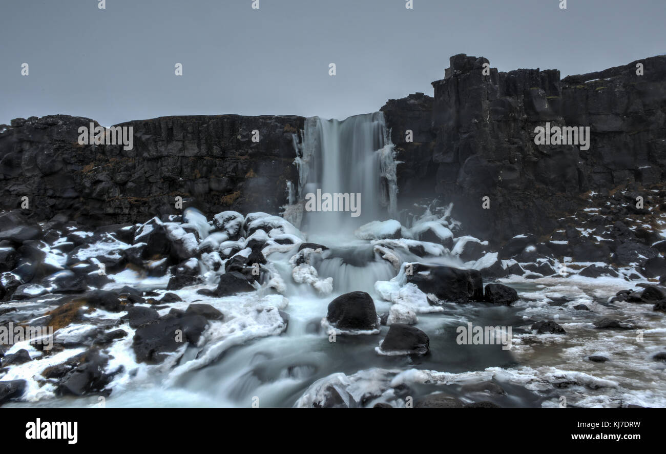 Oxarafoss waterfall in the winter. Part of Thingvellir National Park ...