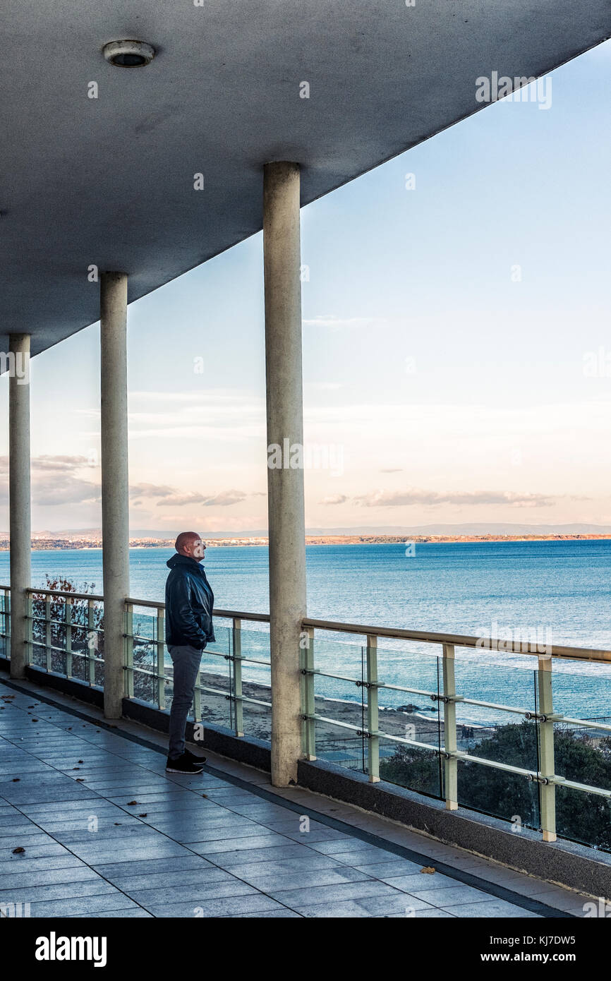 Man on balcony hi-res stock photography and images - Alamy