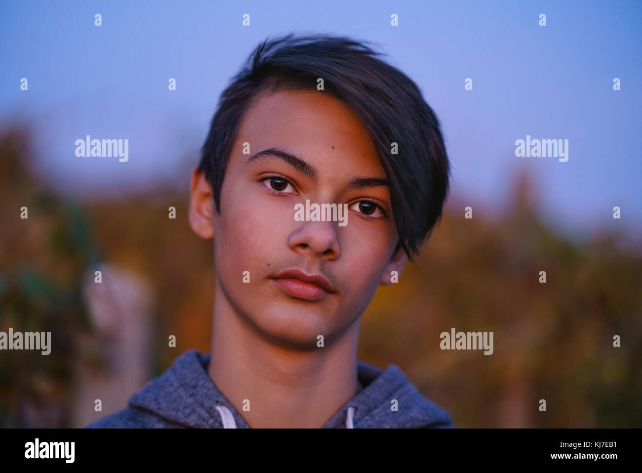 portrait with an Asian young man at sunset Stock Photo - Alamy