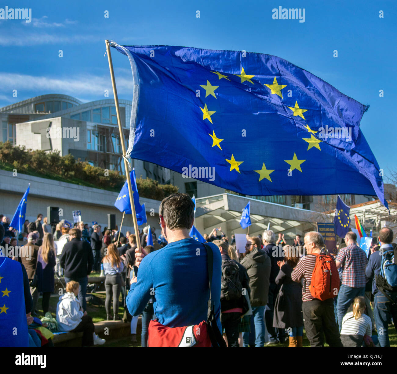 EDINBURGH, SCOTLAND, UK - MARCH 25 2017: A man carrying a European Flag ...