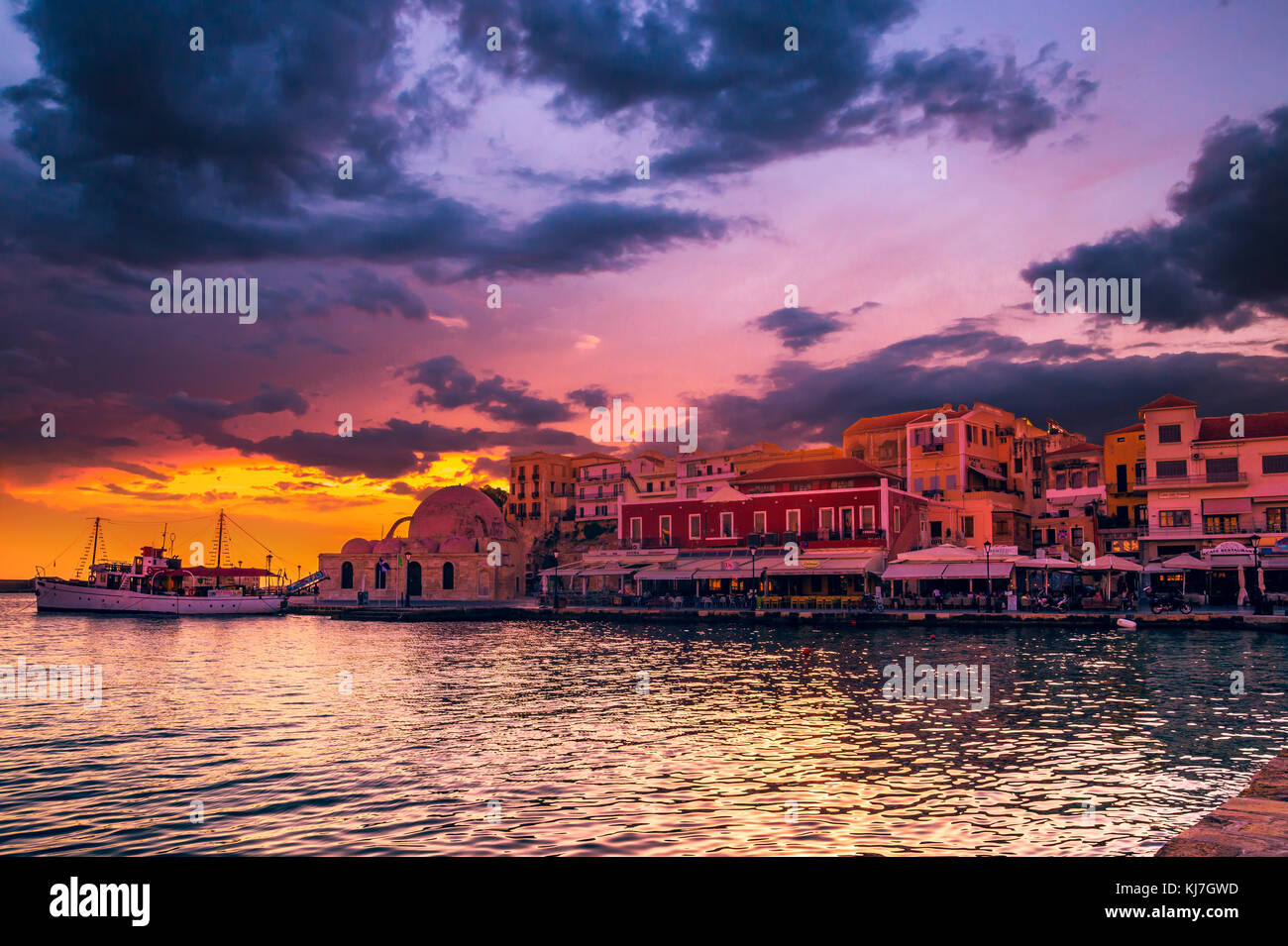 Stunning sunset view of the old venetian port of Chania on Crete island ...