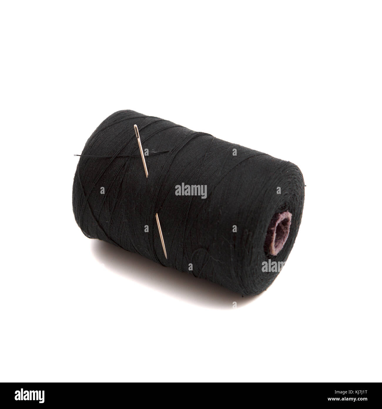 Spool of thread on white background Stock Photo - Alamy
